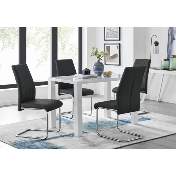 East Urban Home Eubanks High Gloss 4 Seat Rectangular Dining Table Set with Faux Leather ...